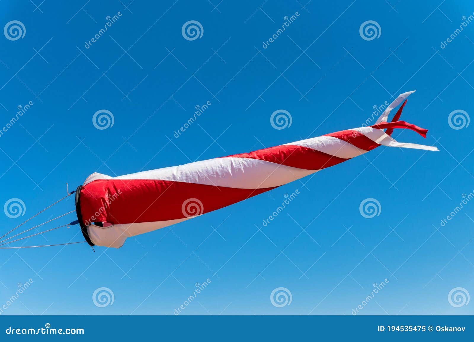Red and White Windsock on a Background of Blue Sky Stock Image - Image ...