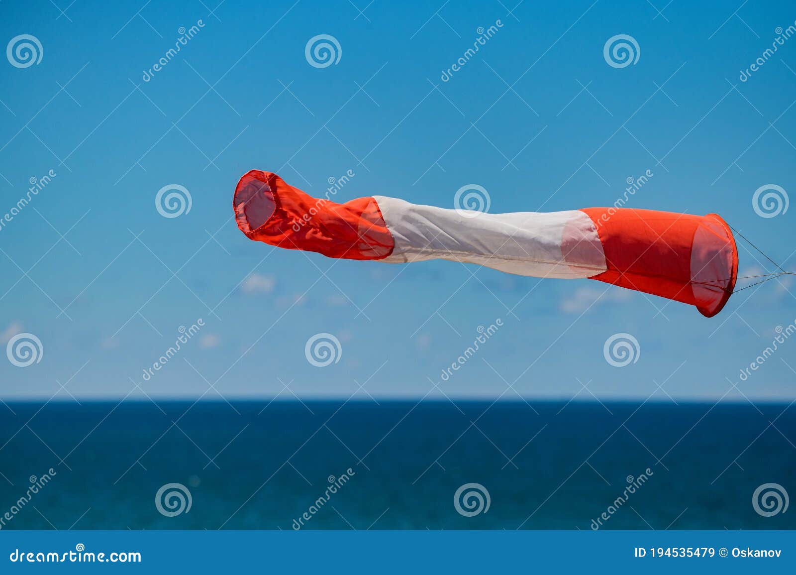 Red and White Windsock on a Background of Blue Sky Stock Image - Image ...