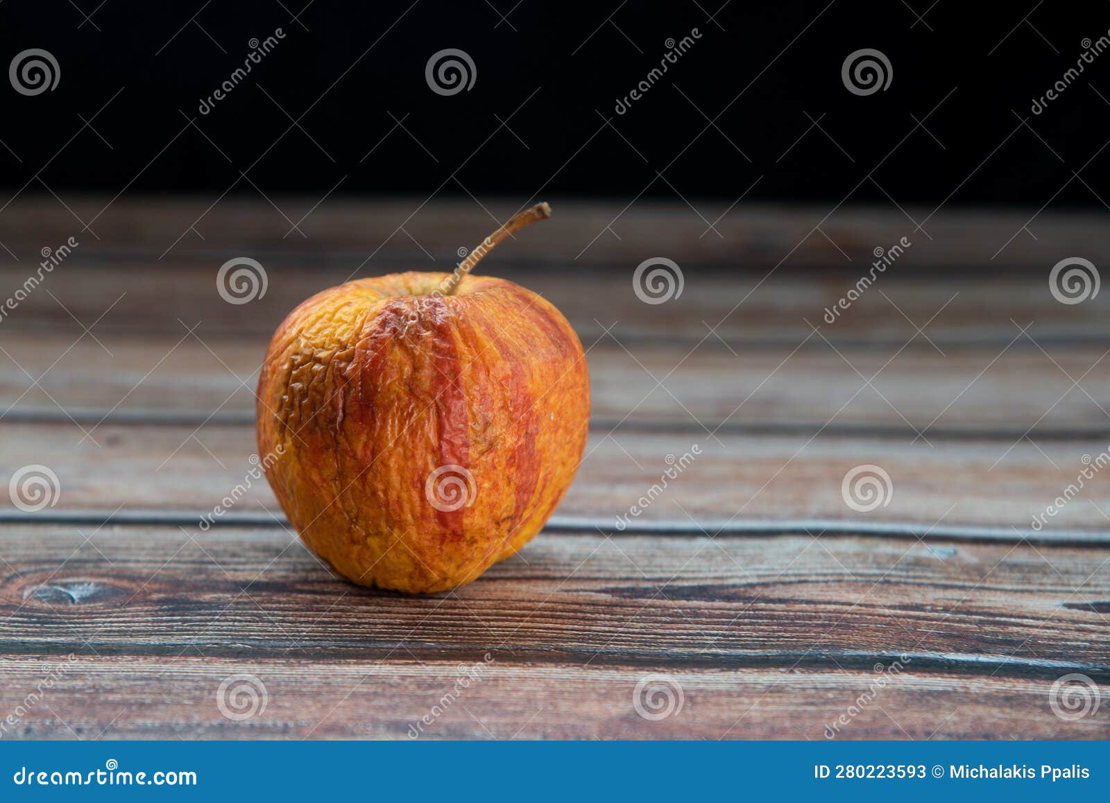 Red Wilted Rotten Apple on a Table. Bacteria Infected Rotten Fruit ...