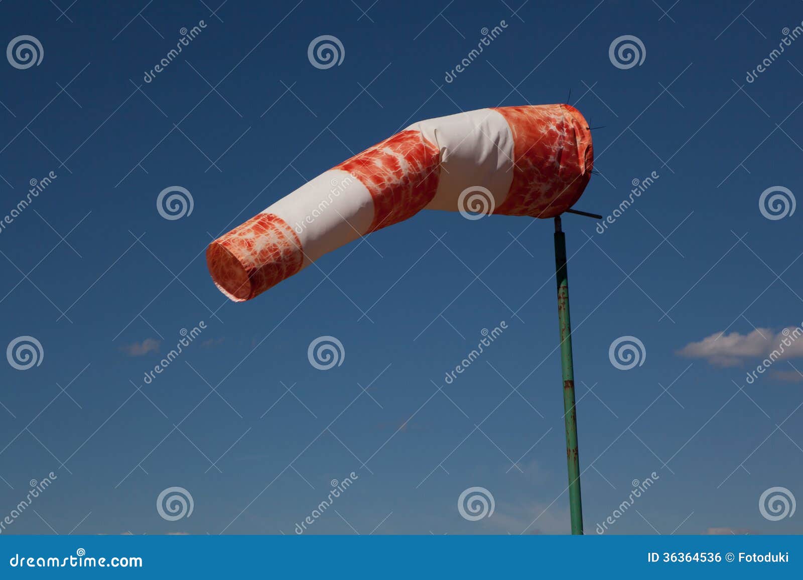 Red Wind Vane Against a Blue Sky Stock Photo - Image of airport, flying ...