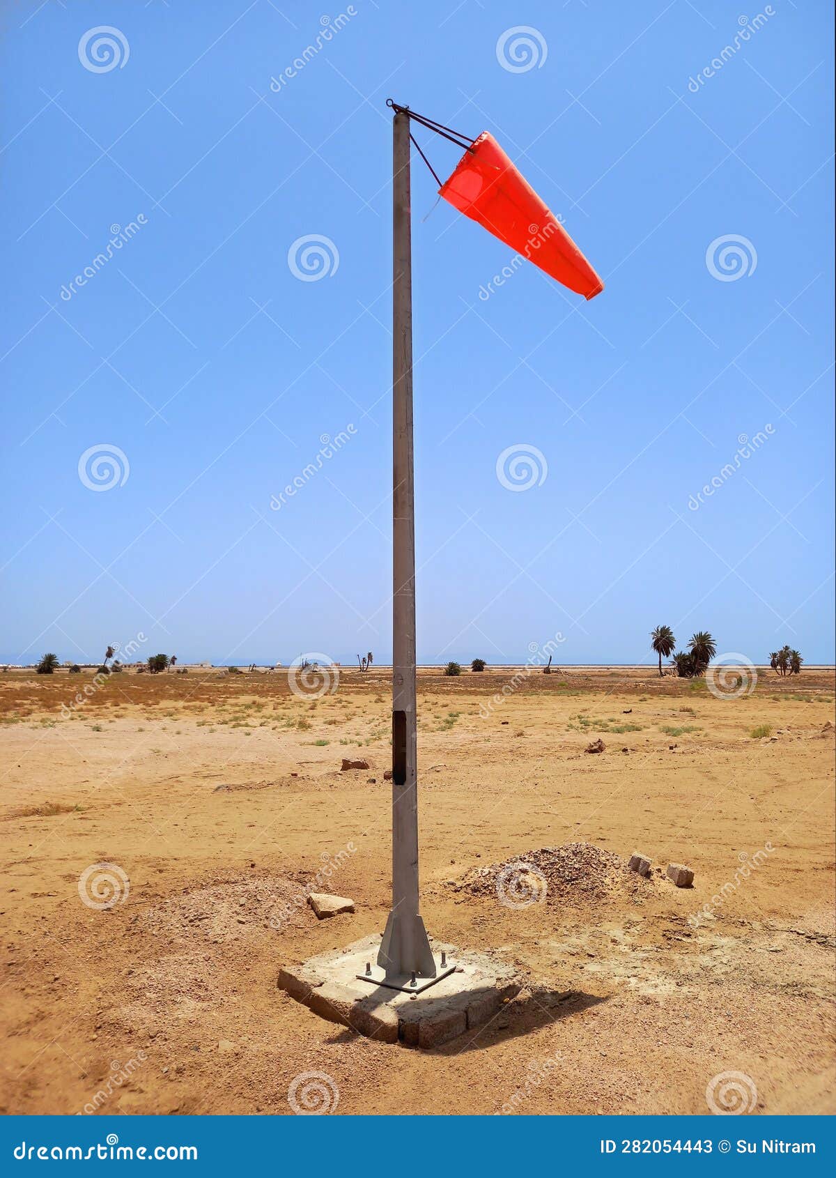 Red Windsock, Wind Sleeve Flying on a Blue Sky of the Egyptian Desert ...