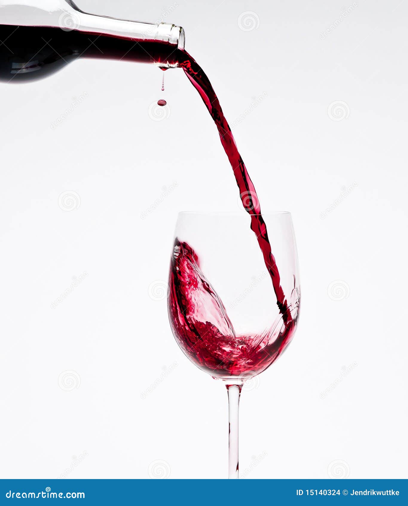 Red wine being poured stock photo. Image of isolated - 15140324
