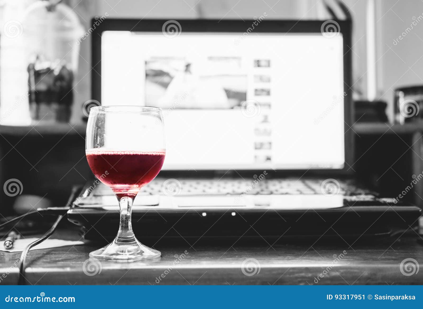 Red Wine in Glass with Computer Laptop on Wooden Table, Relaxing while ...