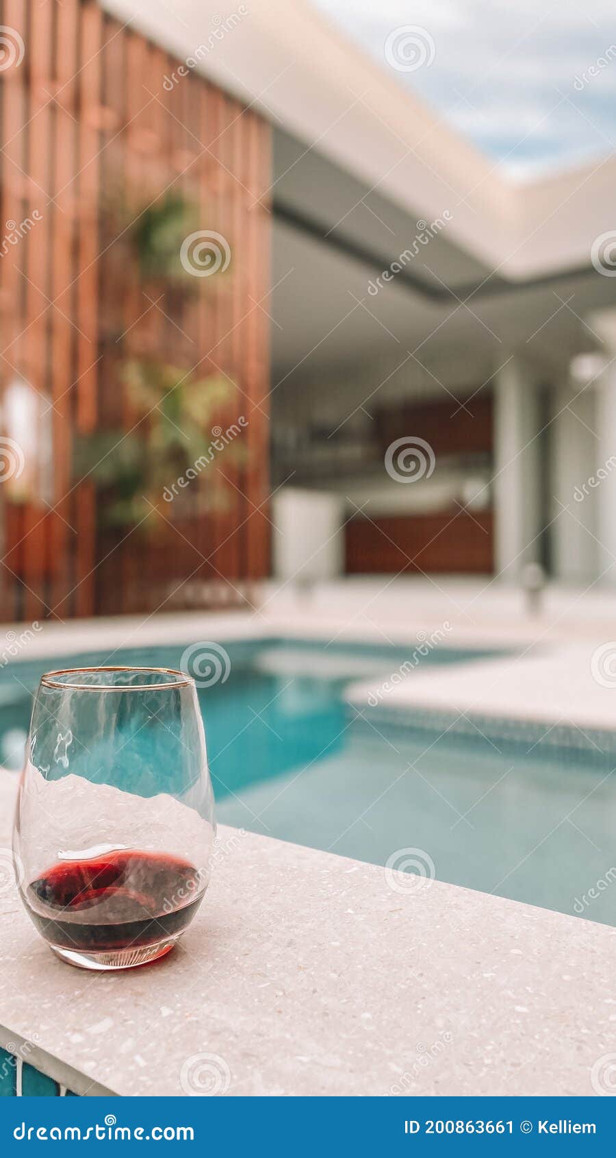 Red wine poolside stock image. Image of glass, poolside - 200863661