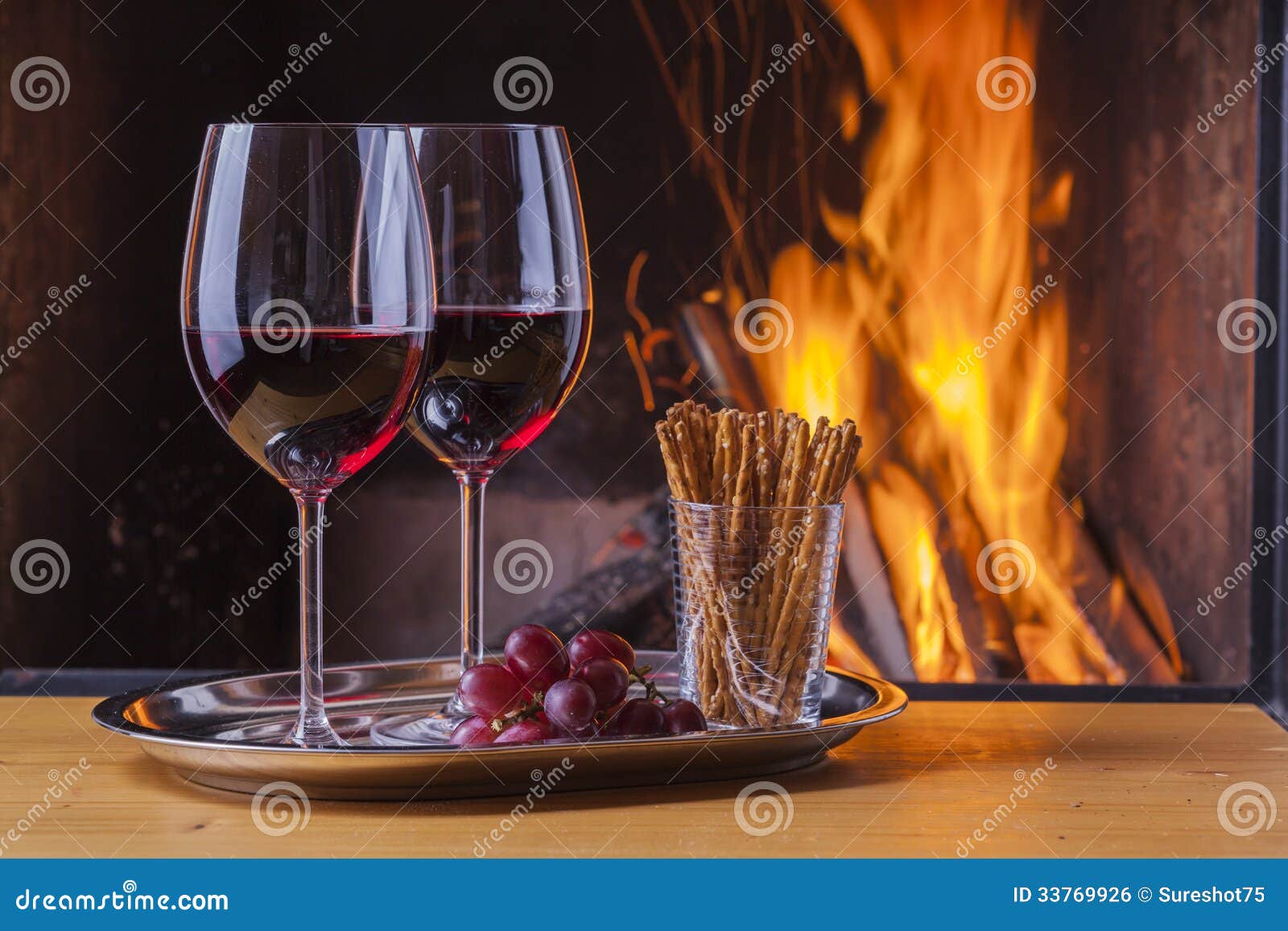 Red Wine with Snacks and Grapes at Fireplace Stock Photo - Image of ...