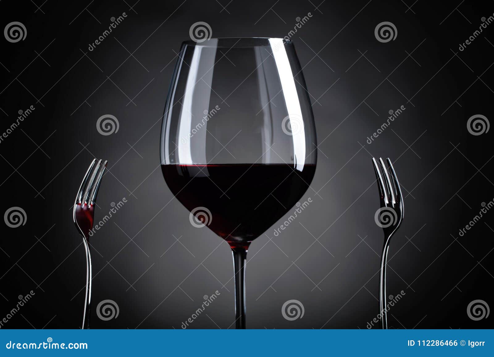 Red wine and two forks. stock photo. Image of space - 112286466