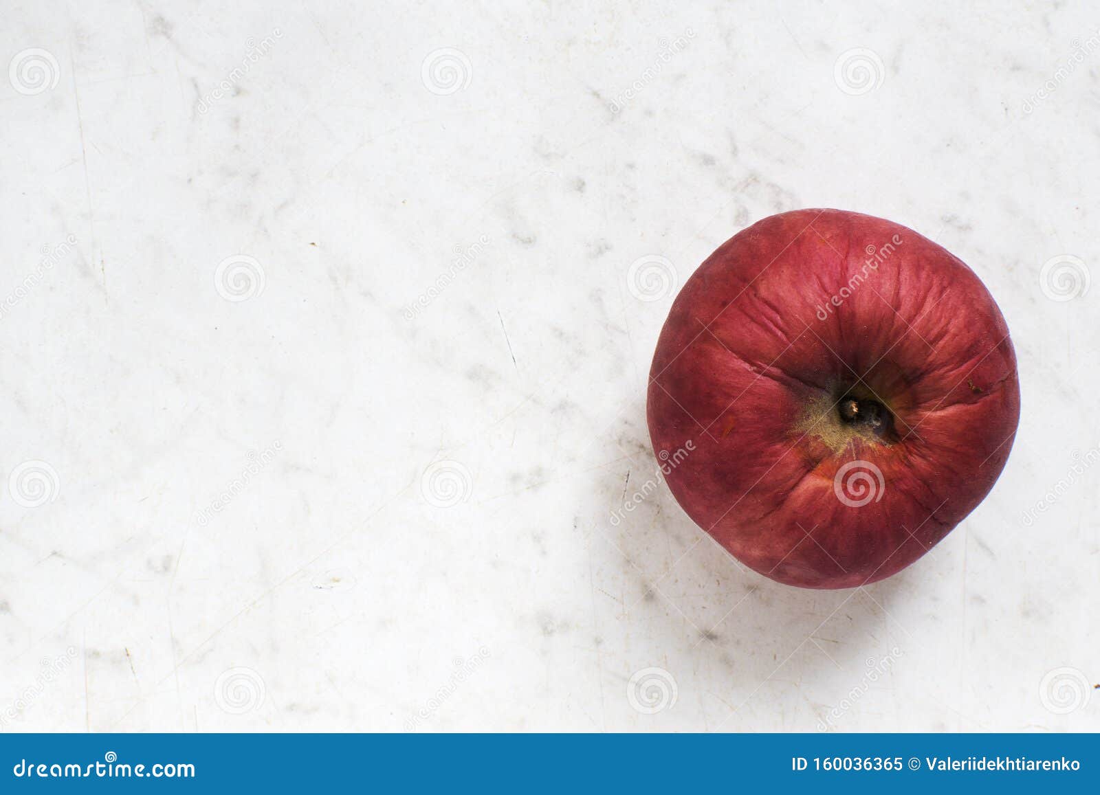Red Withered Apple on Wooden Table Stock Image - Image of contrast ...