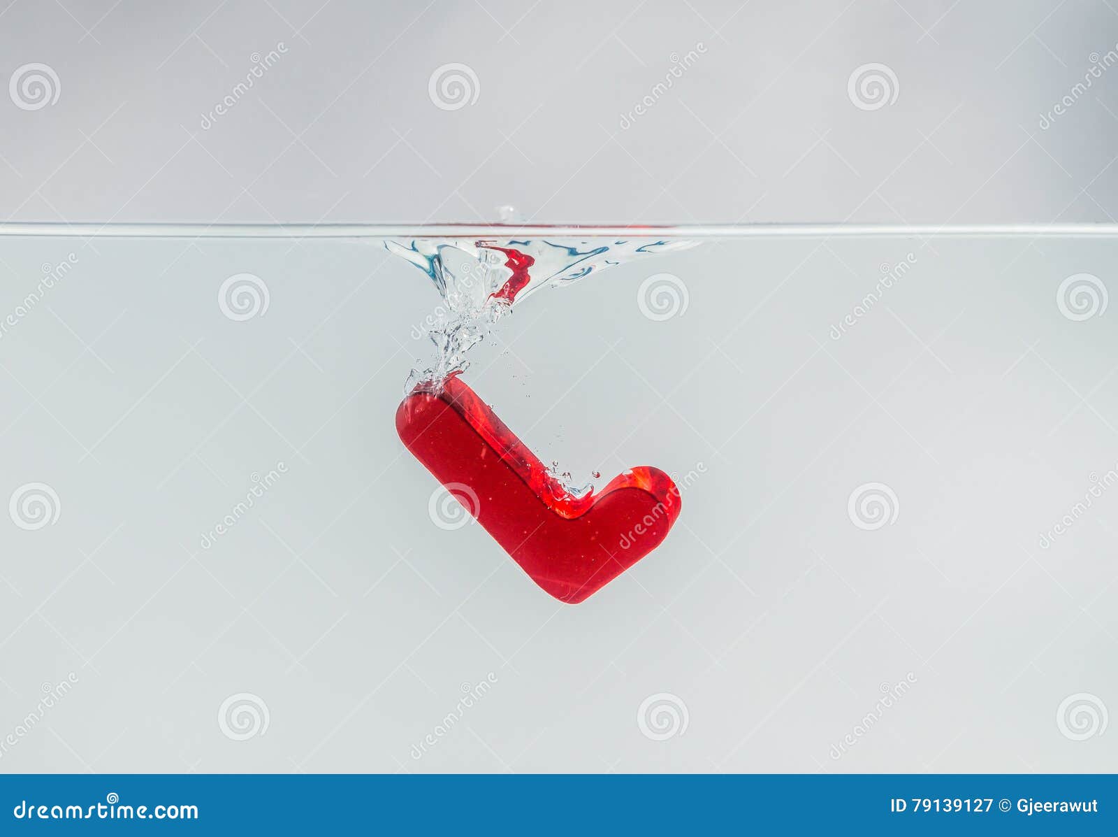 Red Wooden Alphabet L Drop in the Water with White Background and ...