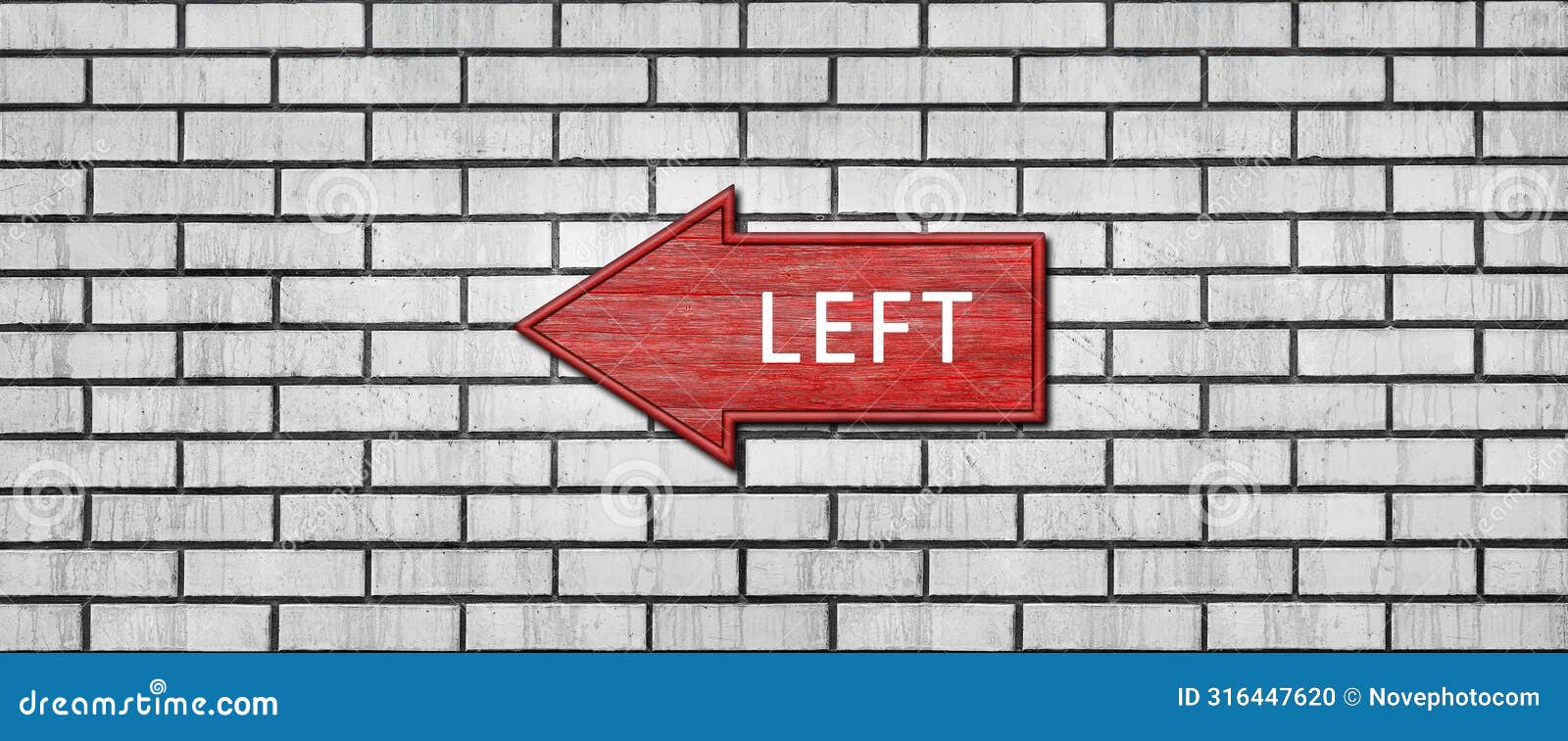 Red Wooden Arrow Sign with the Word LEFT Hanging on a White Brick Wall ...