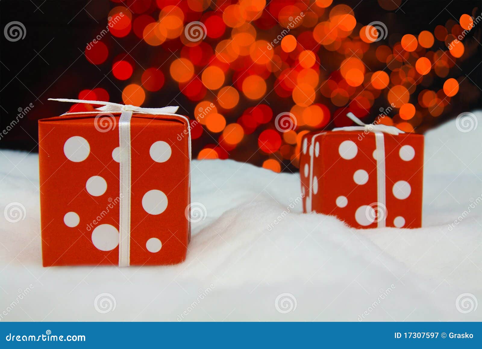 Red Wrapped Gift in Front of Christmas Tree Stock Image - Image of gift ...
