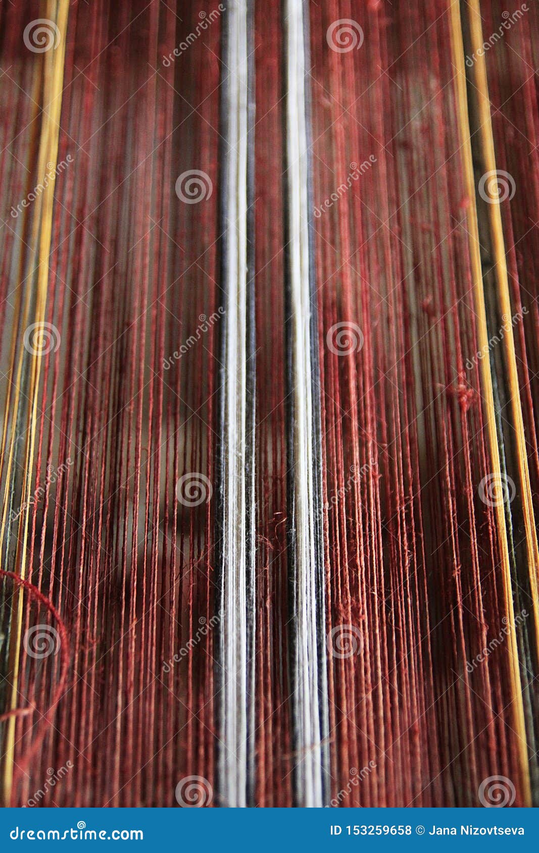 Red yarn on the loom. stock photo. Image of culture - 153259658