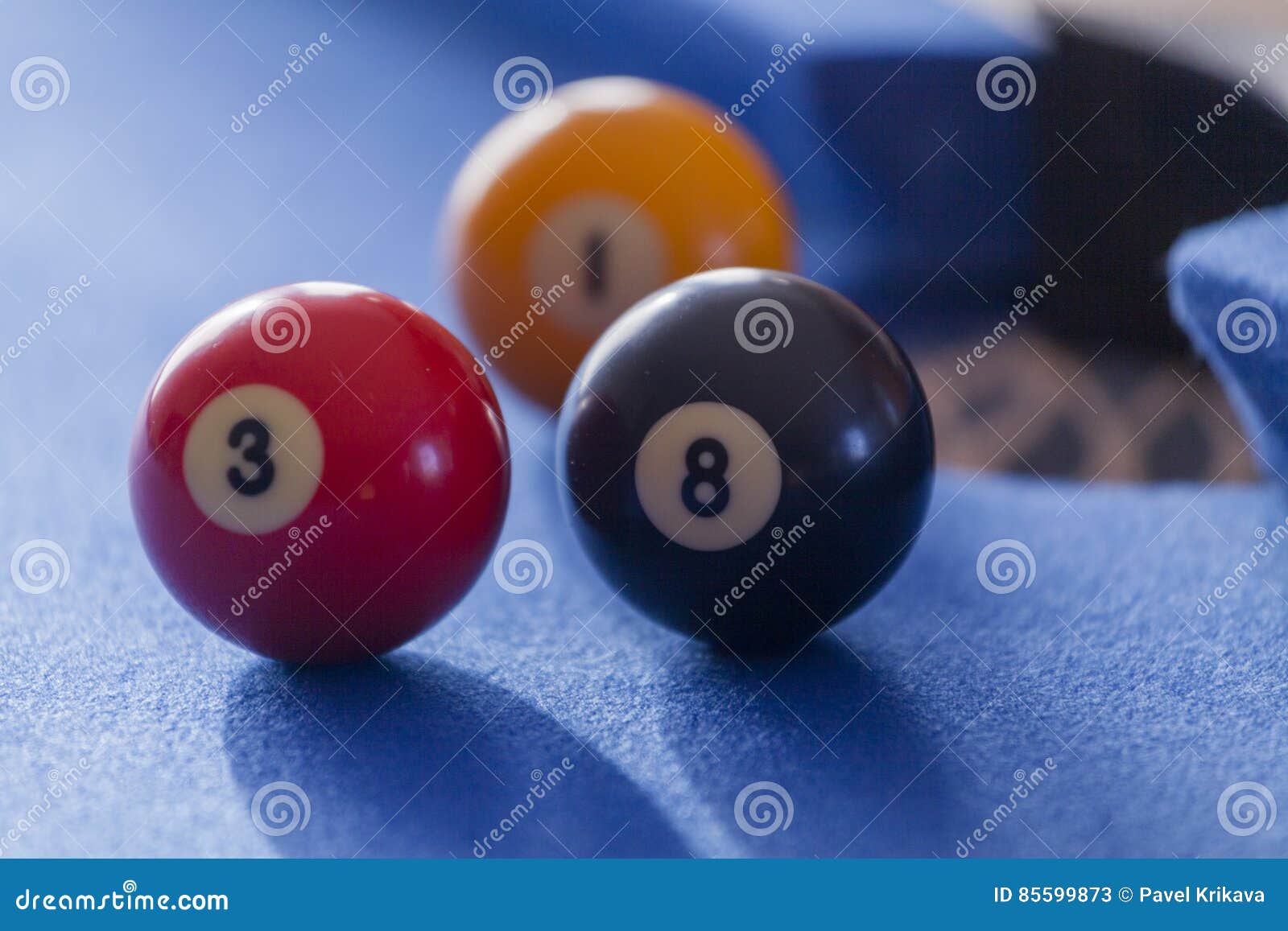 Red, Yellow and Black Billiard Balls in a Pool Table Stock Image ...
