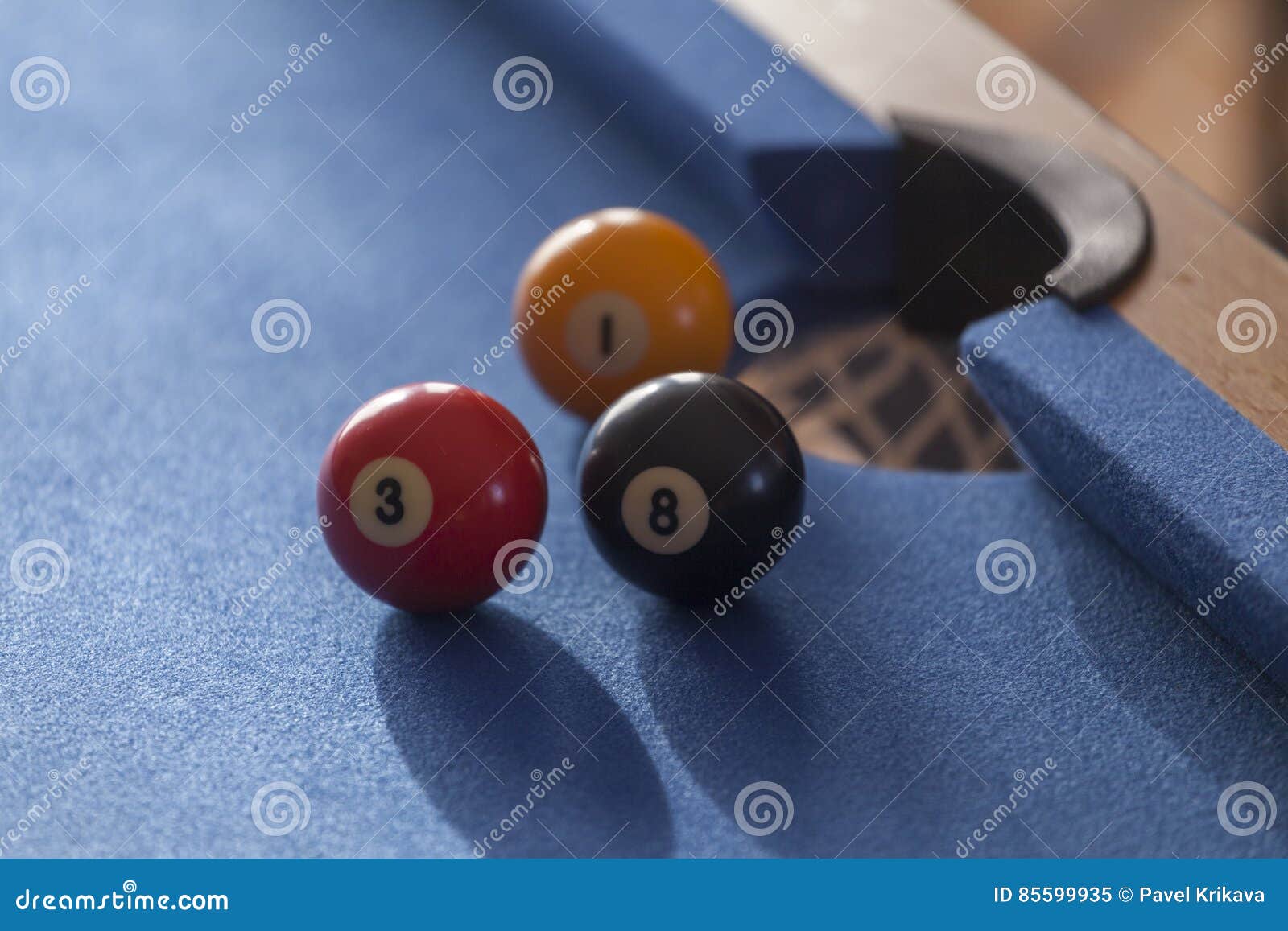 Red, Yellow and Black Billiard Balls in a Pool Table Stock Image ...