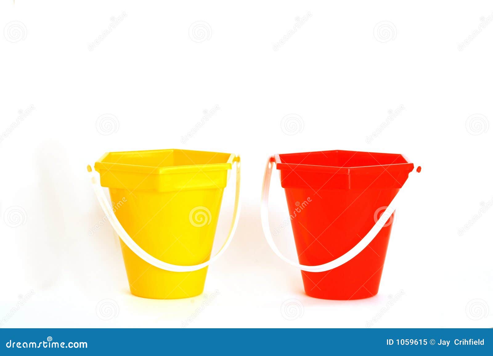 Red and yellow buckets stock image. Image of enjoy, childhood - 1059615