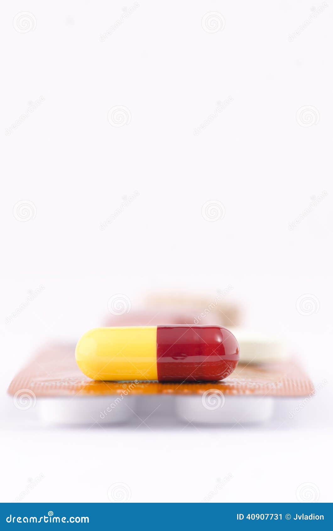 Red and Yellow Capsule on a Blister Stock Image - Image of shiny ...
