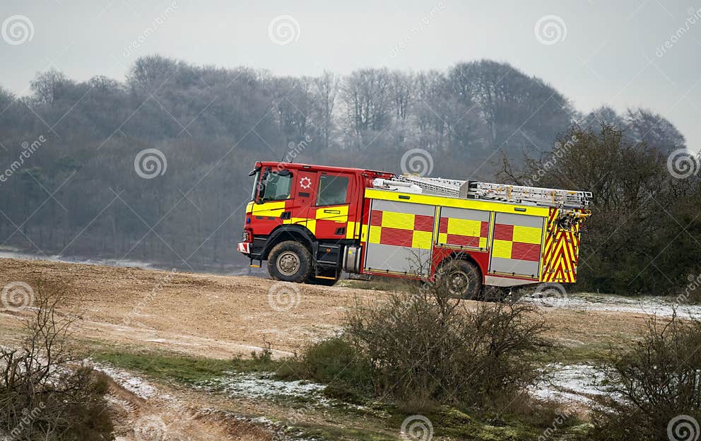 Red and Yellow Fire Engine Driven Off Ro Stock Photo - Image of machine ...