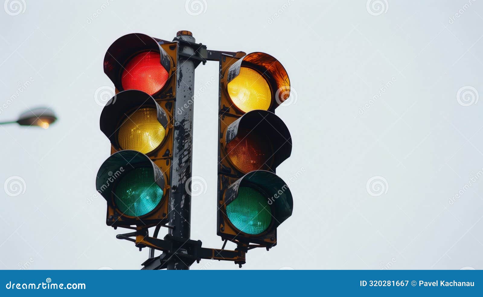 Red, Yellow, and Green Lights Illuminated on a Traffic Light Stock ...