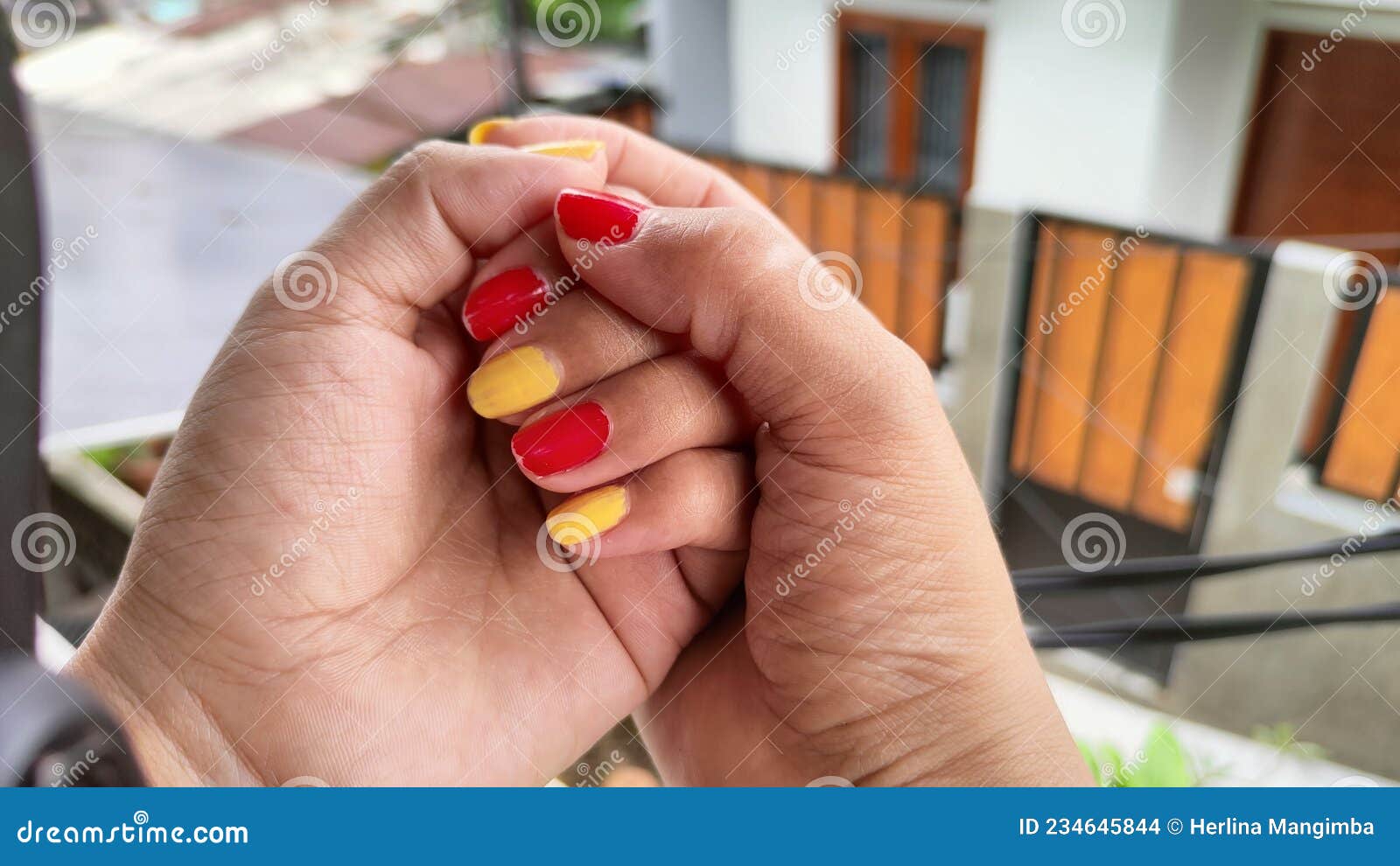 The Red and Yellow Nails Polish Stock Photo - Image of hand, yellow ...