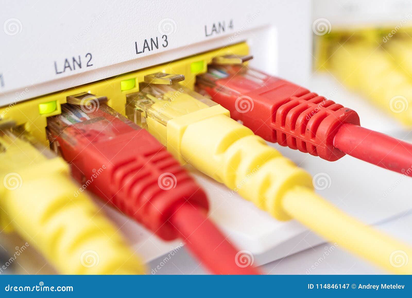 Red and Yellow Patch Cords are Inserted into the Router of White Color ...