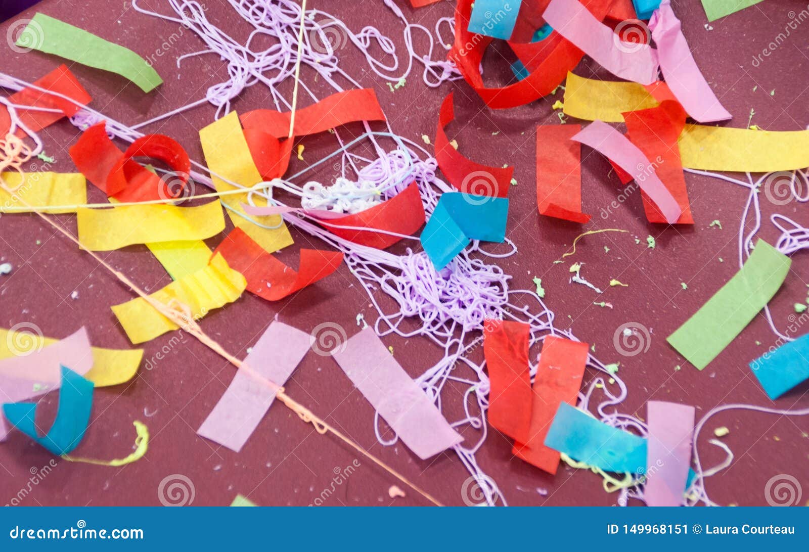 Multi-colored Streamers and String on a Maroon Background Stock Image ...