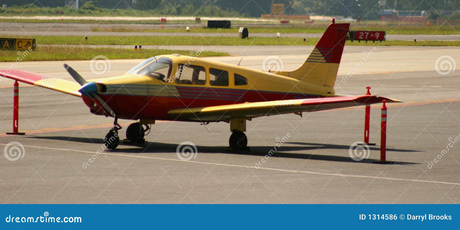 Red and Yellow Plane stock photo. Image of flight, tarmac - 1314586