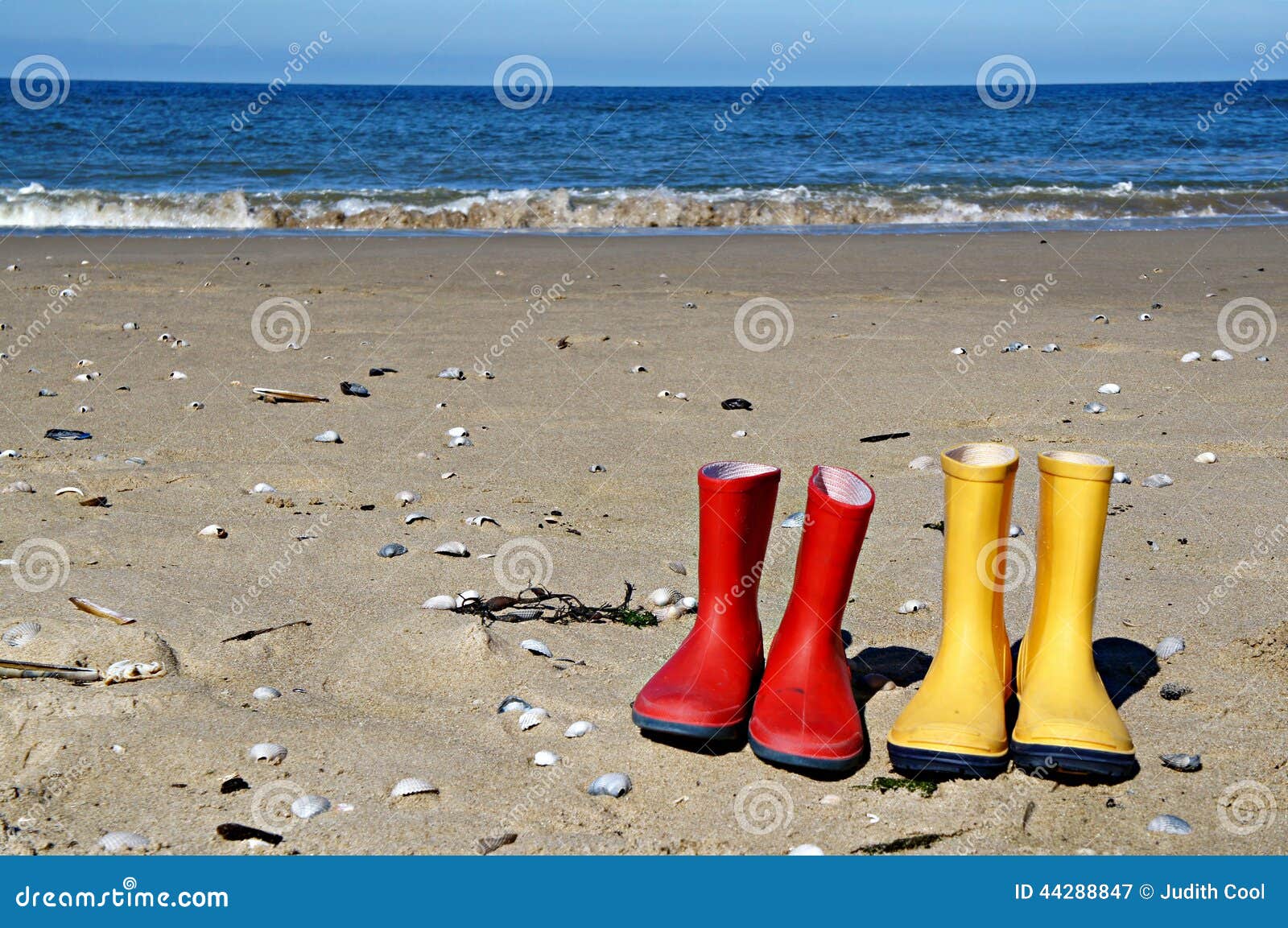 Red and Yellow Rain Boots on the Beach Stock Image - Image of relax ...