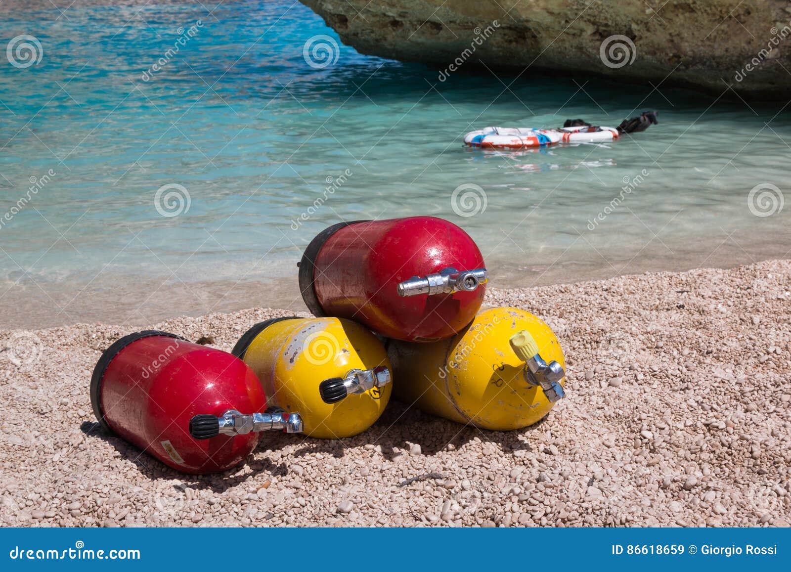 Red and Yellow Scuba Oxygen Tanks for Divers on a Beach Stock Image ...