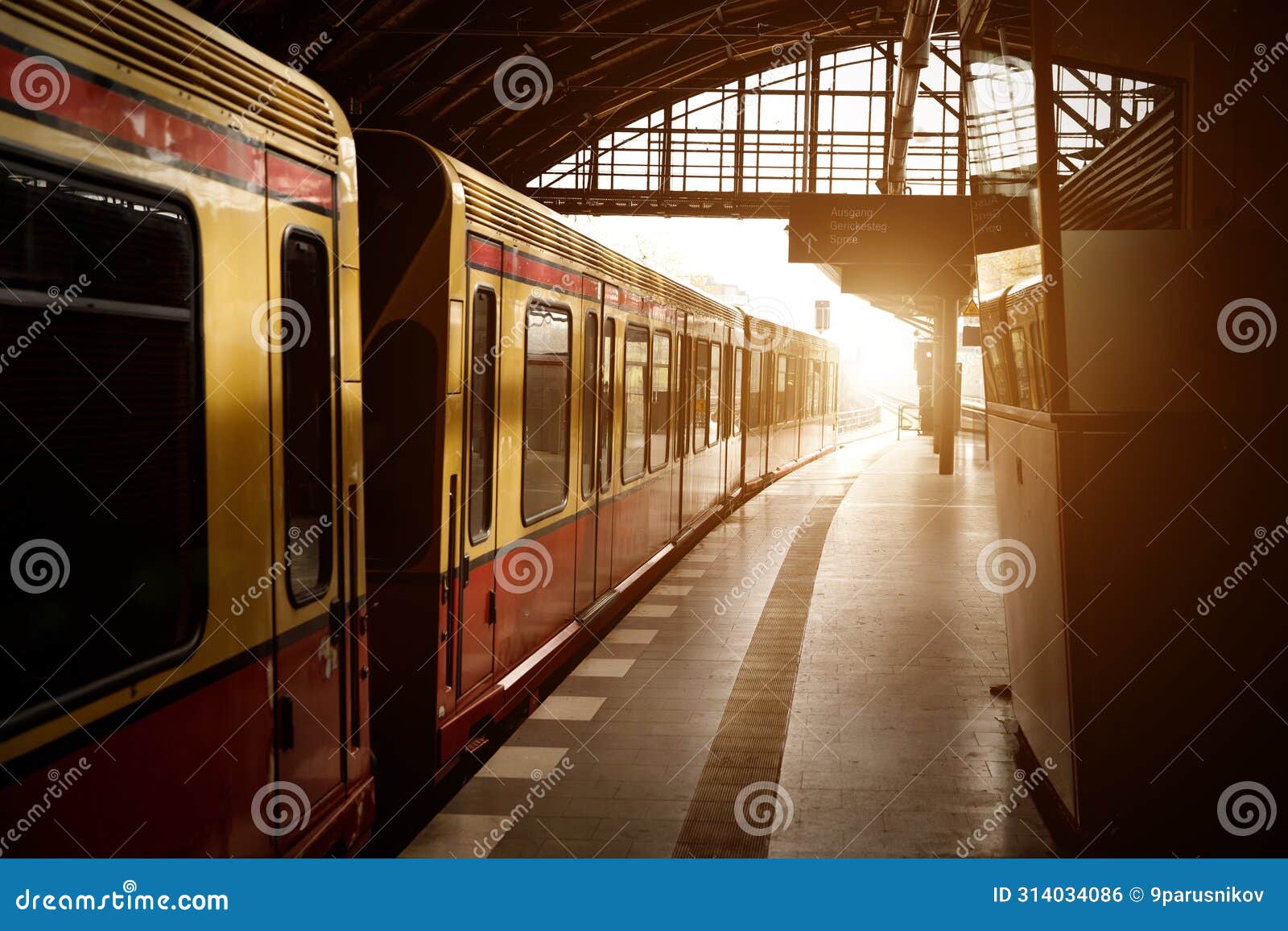 The Red and Yellow Train Stands on the Empty Platform of the Train ...