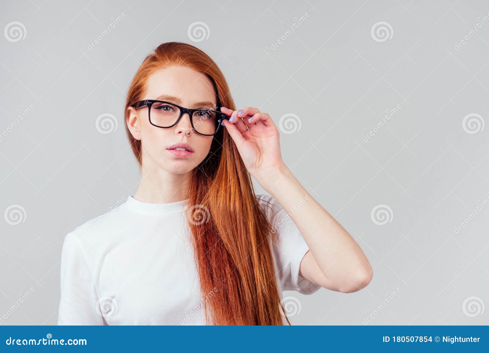 Redhaired Ginger Woman Wearing Glasses And White Cotton Eco T Shirt In
