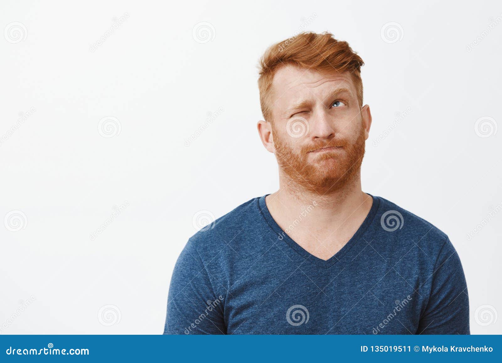 Redhead Attractive Male With Bristle In Casual Blue T Shirt Pursing