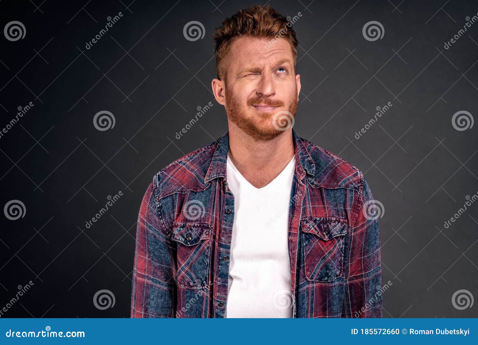 Redhead Attractive Male With Bristle In Casual Shirt Pursing Lips