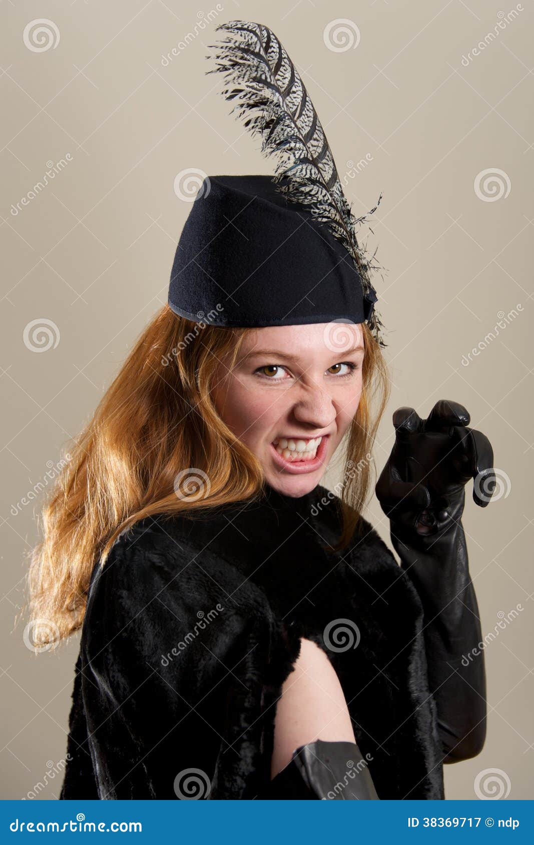 Redhead in Black Hat Pretending To Snarl Stock Image - Image of feather ...