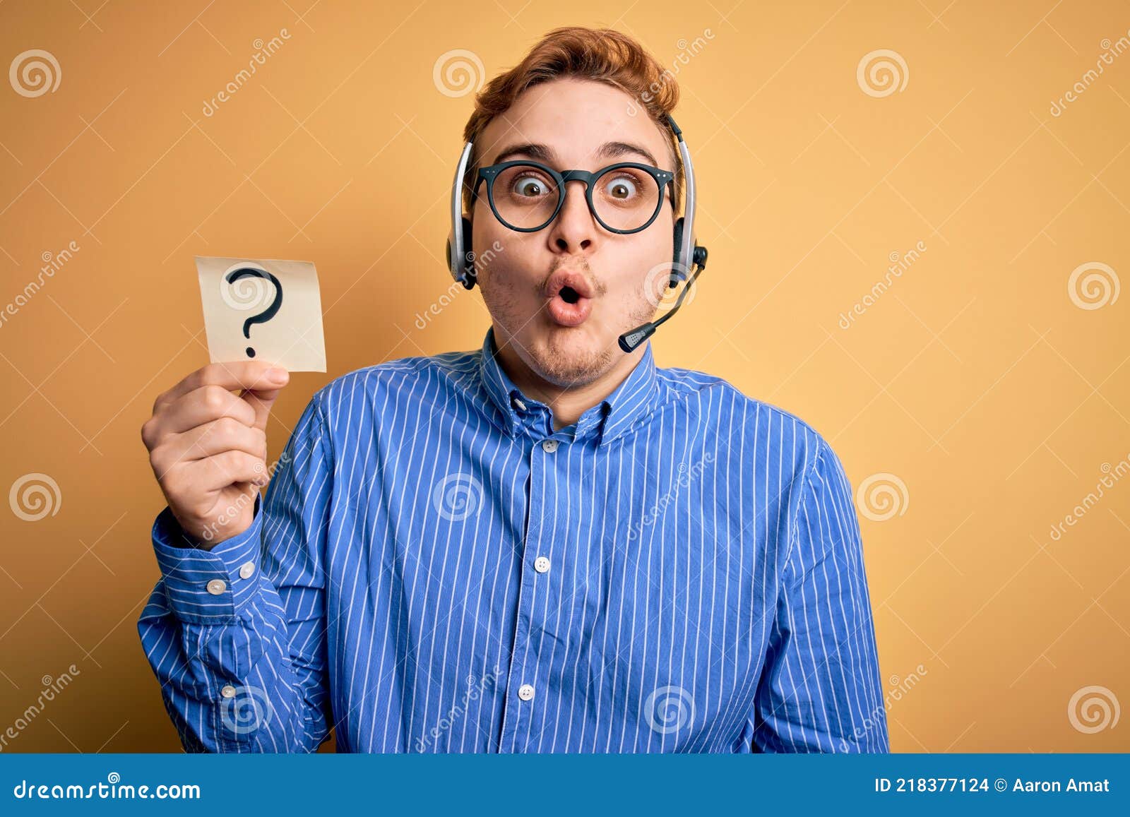 Redhead Call Center Agent Man Working Using Headset Holding Reminder ...