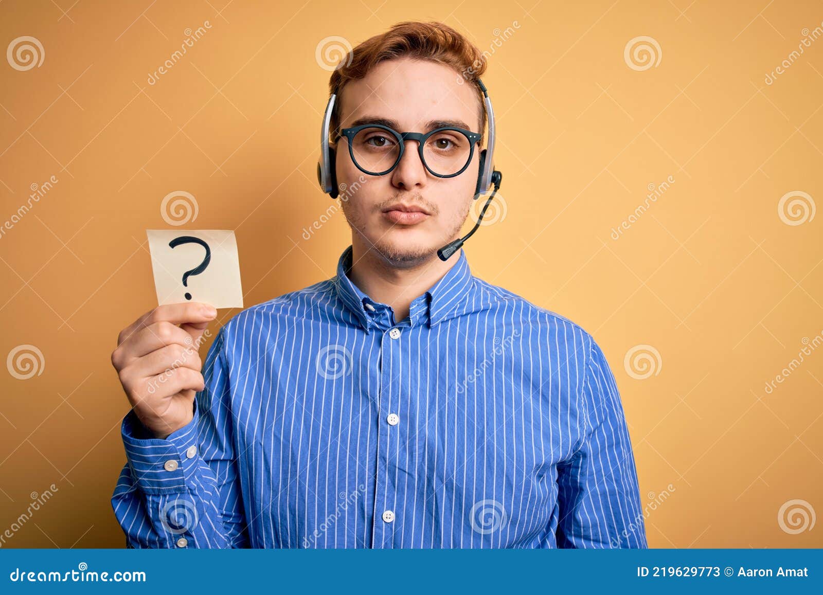 Redhead Call Center Agent Man Working Using Headset Holding Reminder ...