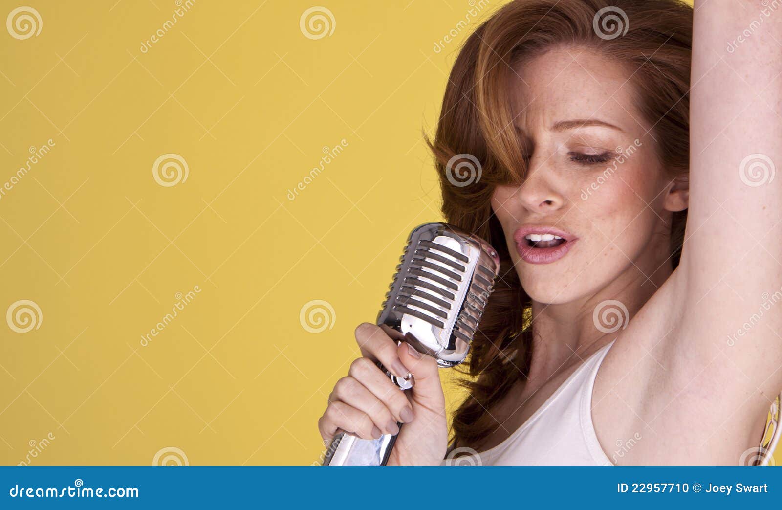 Redhead female singer. stock photo. Image of mike, performance - 22957710