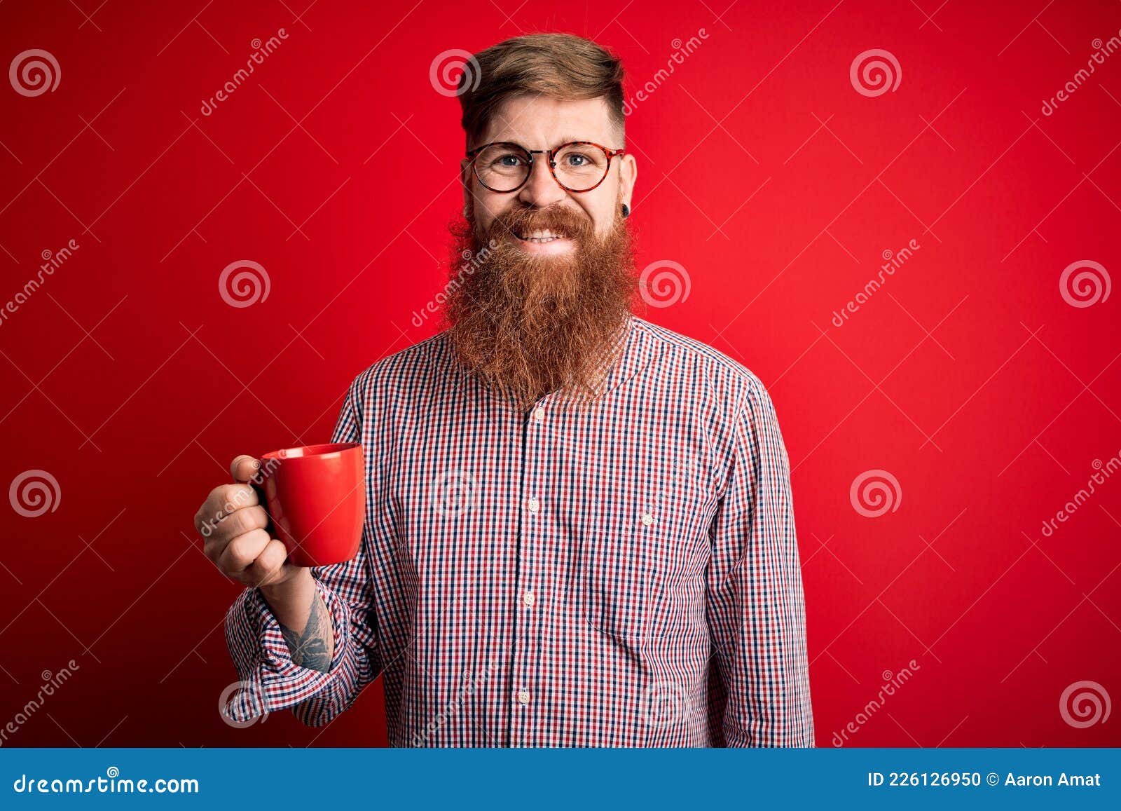 Redhead Irish Man With Beard Doing Housework Laundry Over Yellow Background With Angry Face