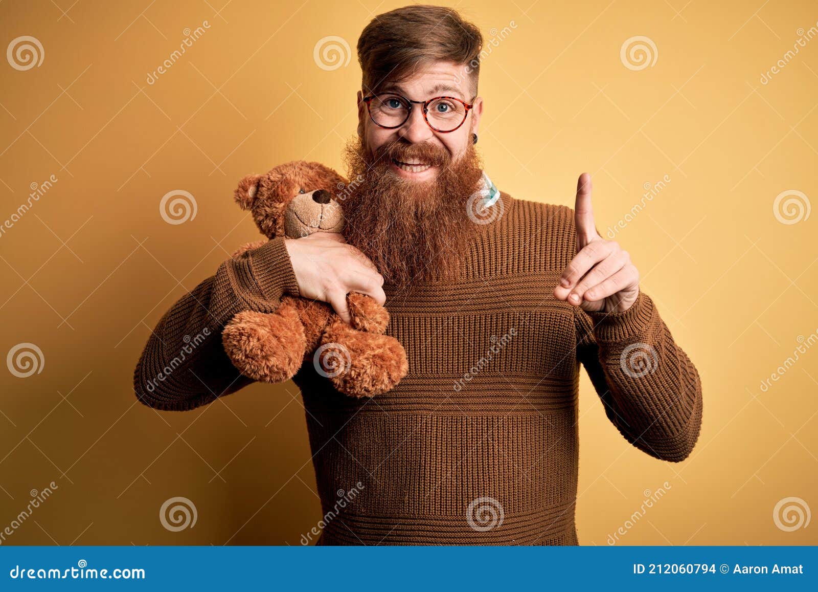 Redhead Irish Man With Beard Doing Housework Laundry Over Yellow Background With Angry Face