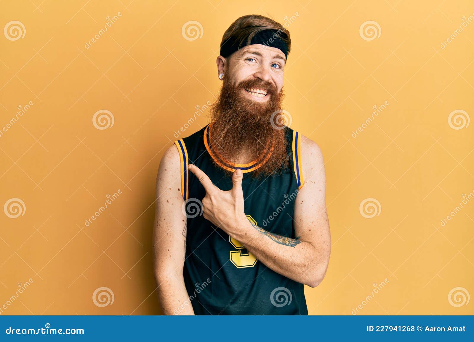 Redhead Man With Long Beard Wearing Basketball Uniform Cheerful With A