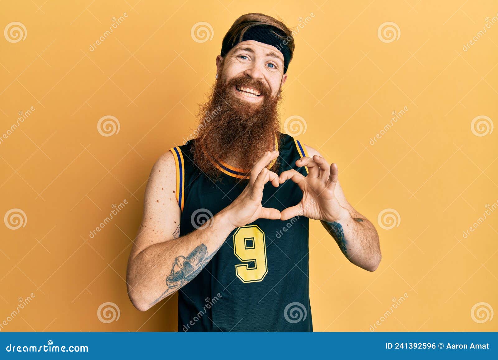 Redhead Man With Long Beard Wearing Basketball Uniform Smiling In Love