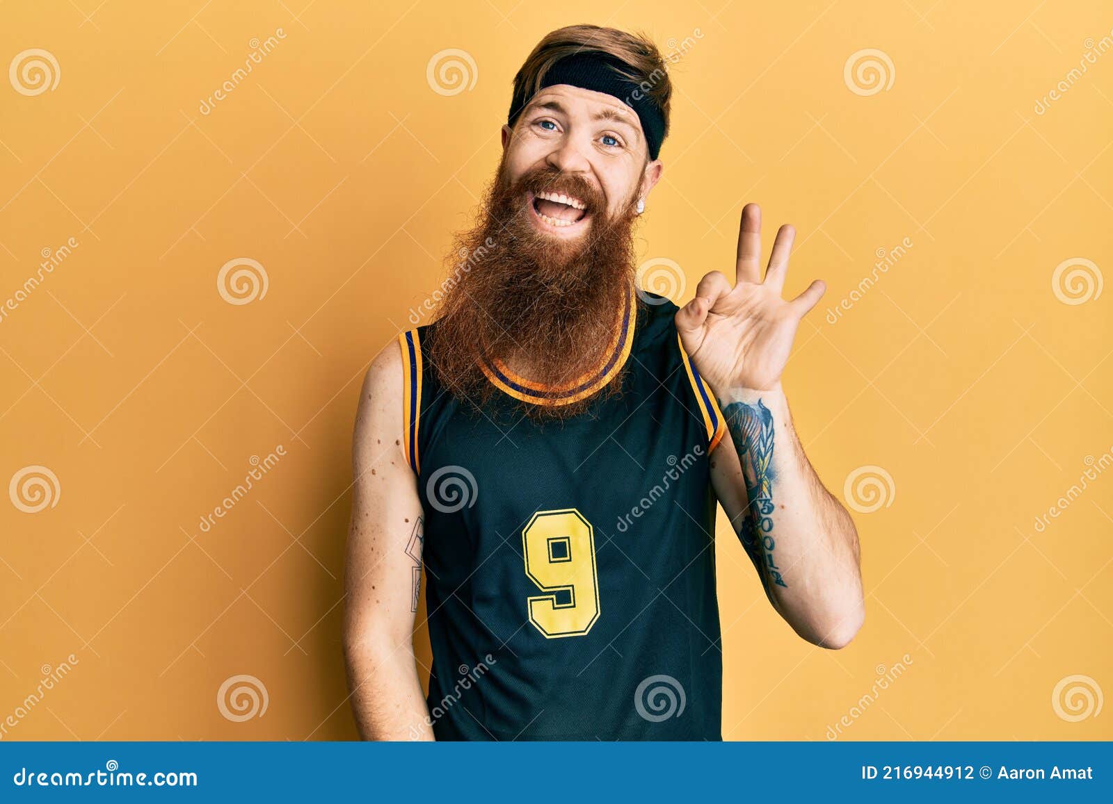 Redhead Man With Long Beard Wearing Basketball Uniform Smiling Positive