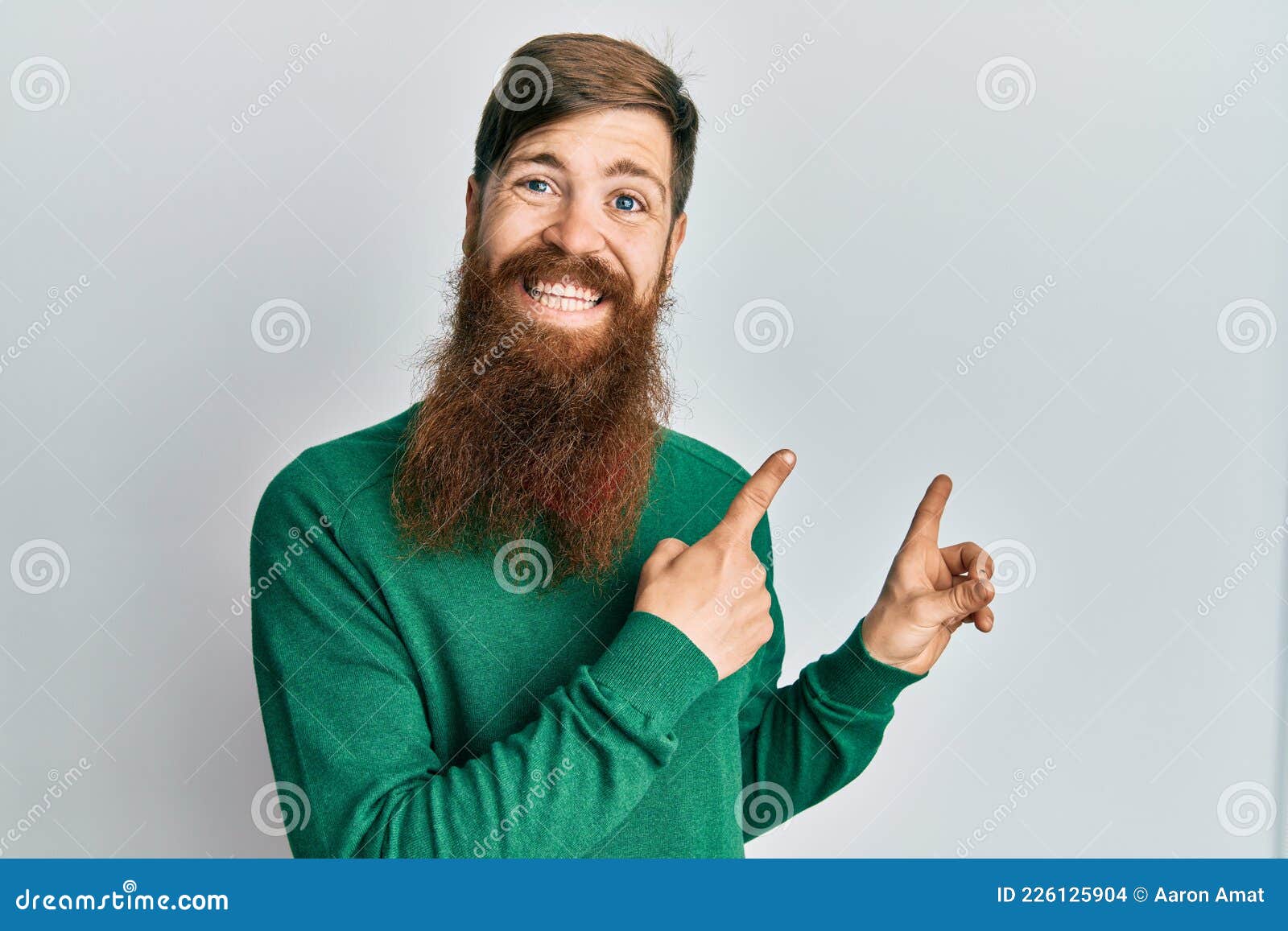 Redhead Man With Long Beard Wearing Casual Clothes Smiling And Looking