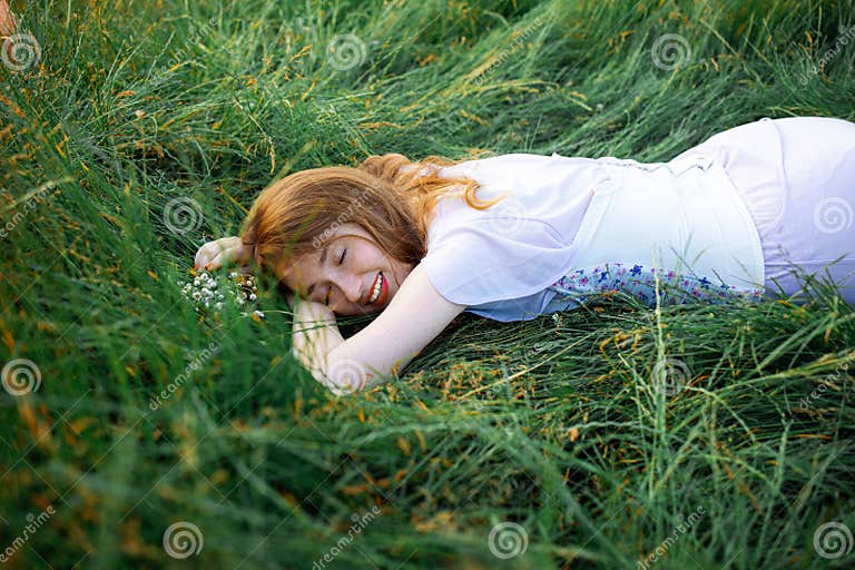 Redhead Portrait Of A Beautiful Young Red Haired Woman Lying In The