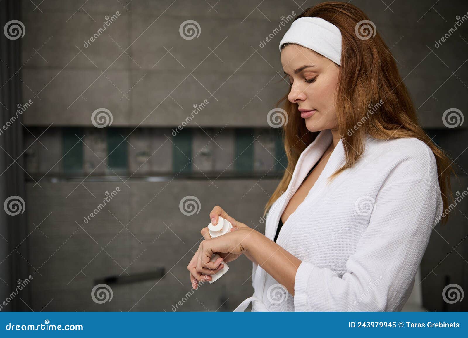 Redhead Pregnant European Woman In White Waffle Bathrobe Standing In