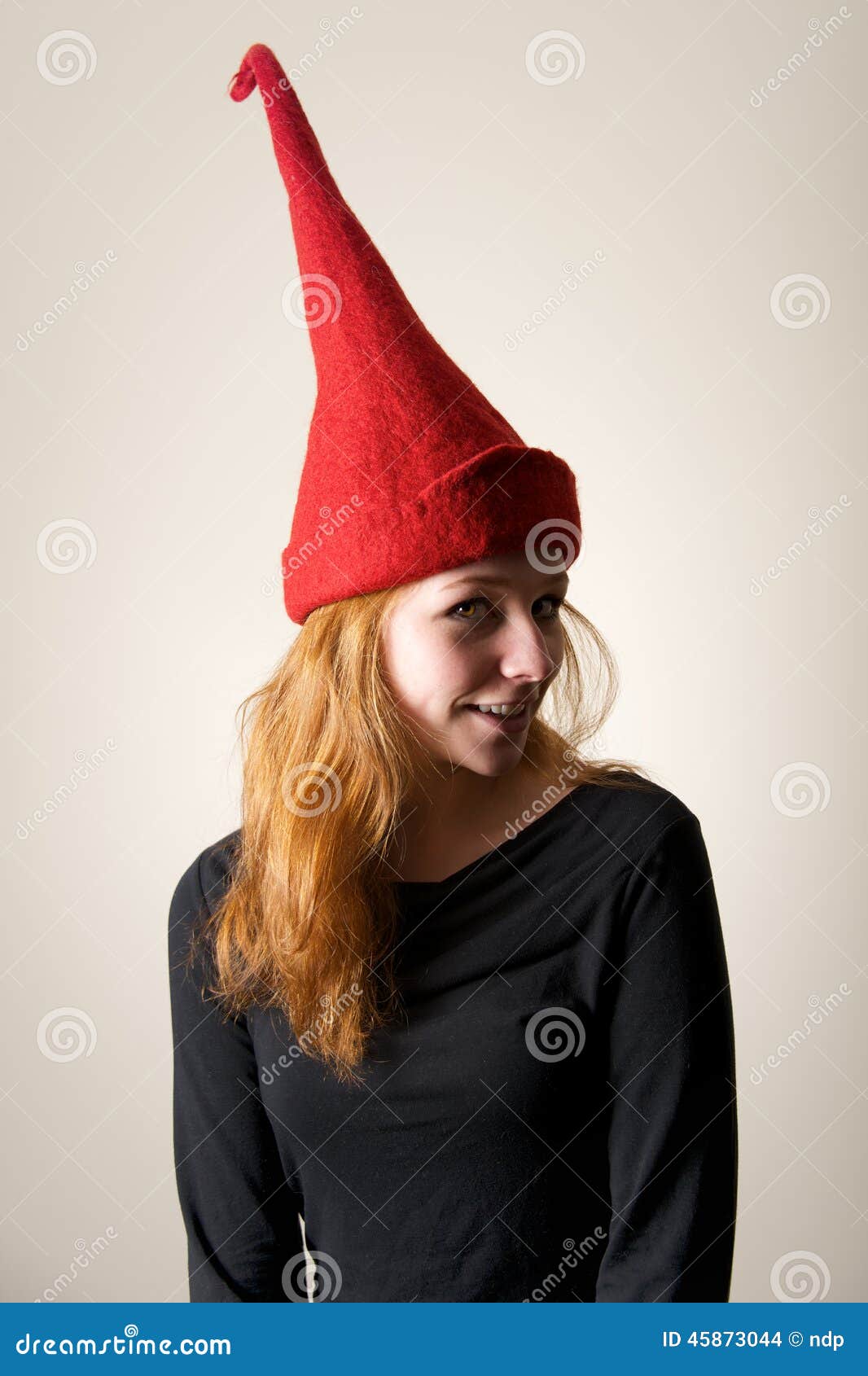 Redhead in Red Pointed Hat Turning Head Stock Photo - Image of woman ...