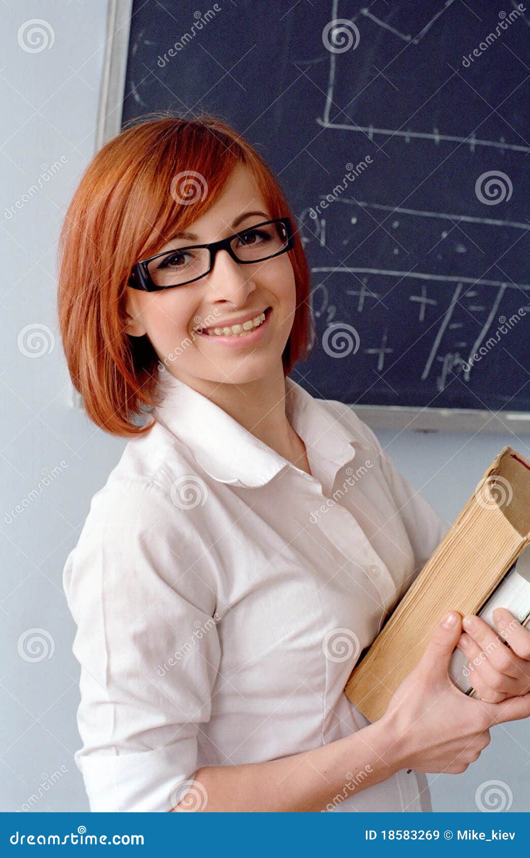 Redhead Schoolgirl in Front of Blackboard Stock Image - Image of ...