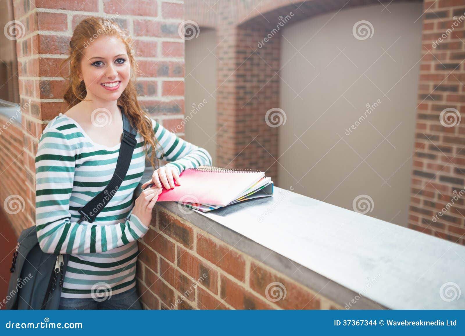 Redhead Student Smiling at Camera in the Corridor Stock Photo - Image ...