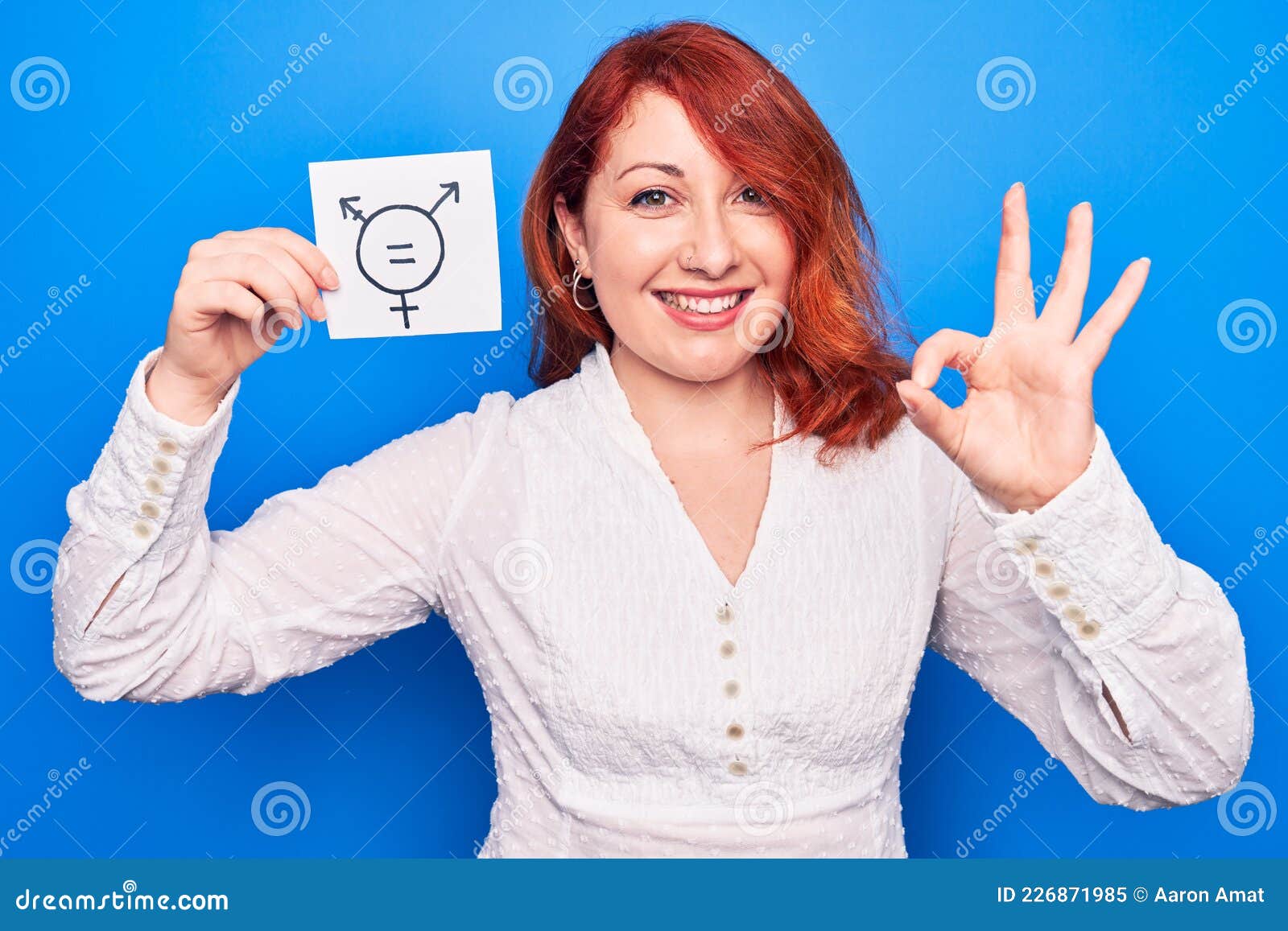Redhead Woman Asking For Sex Discrimination Holding Paper With