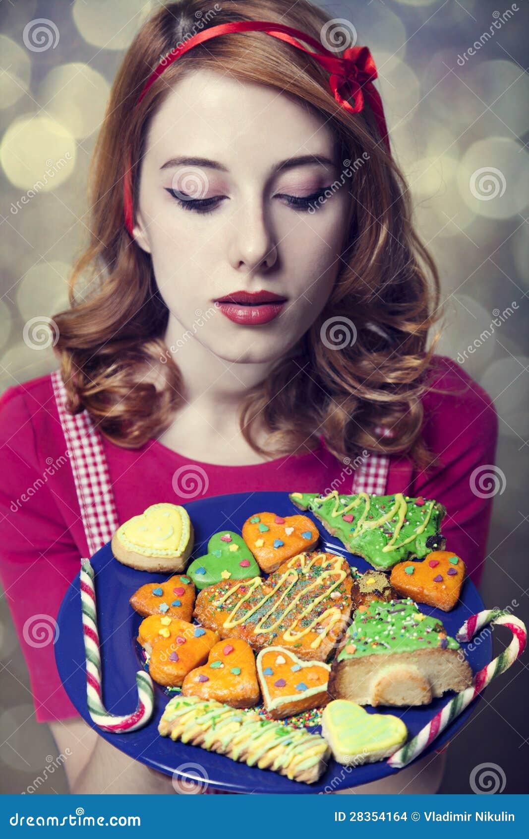 Redhead women with cookies stock photo. Image of close - 28354164