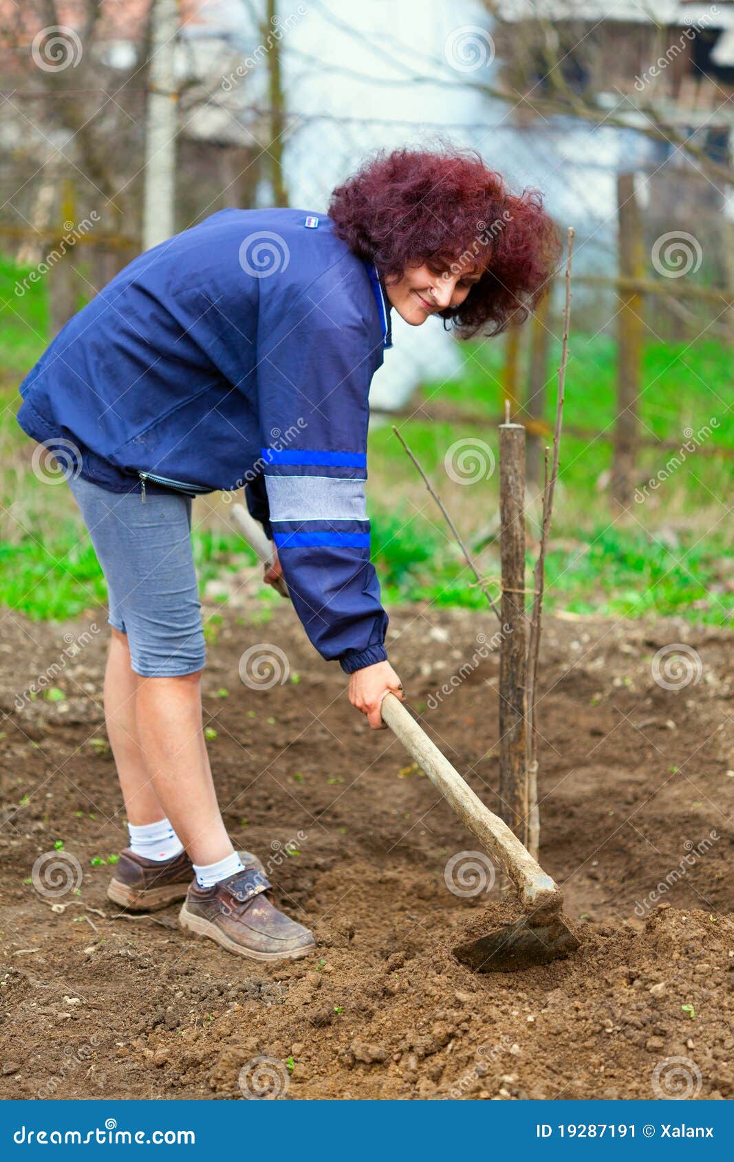 Redhead Young Lady Digging in the Garden Stock Image - Image of ...