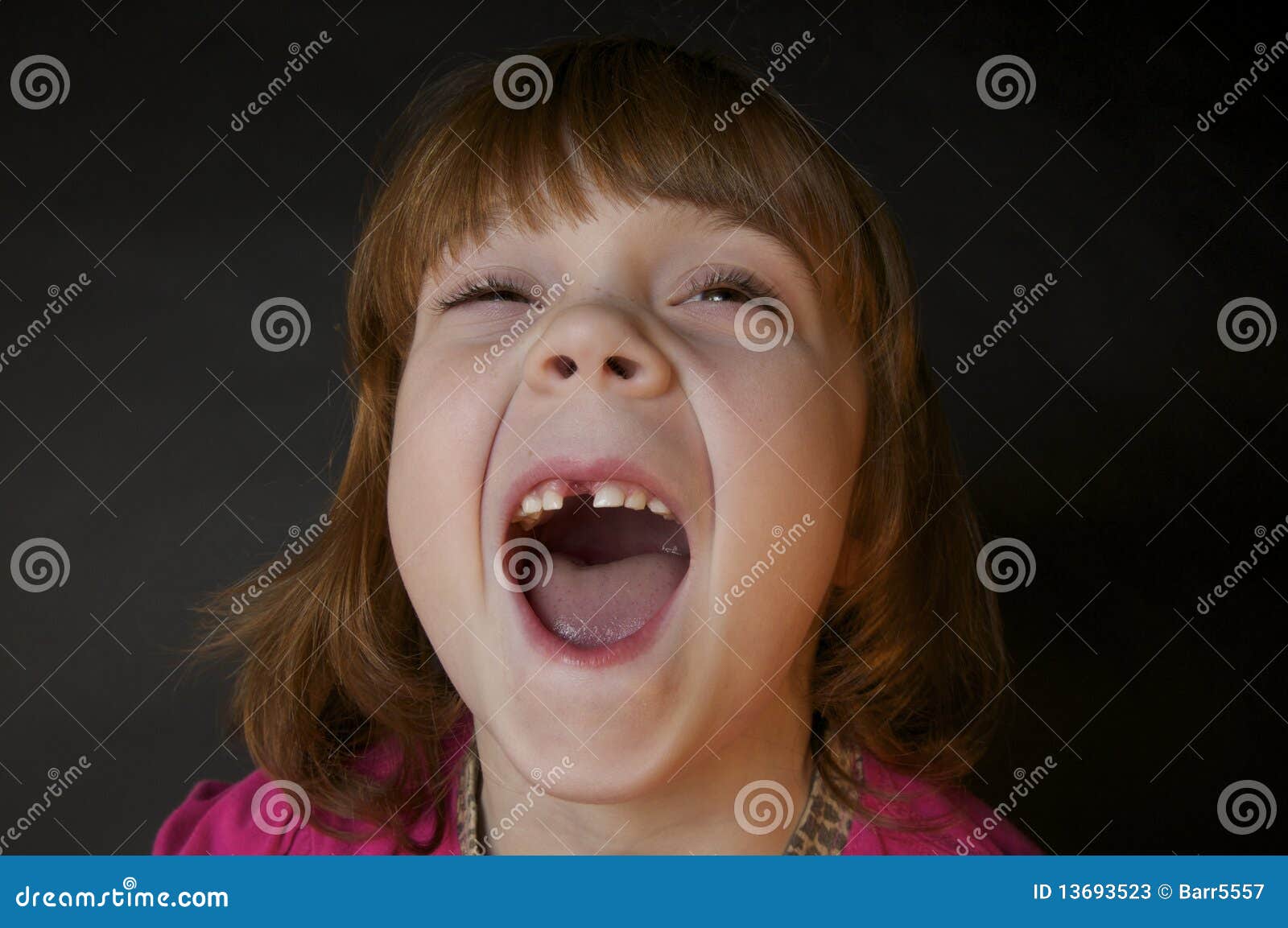 The Girl With The Missing Tooth Tooth Shows A Toy At Arm`s Length Stock ...